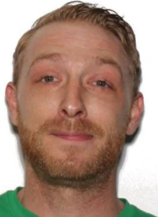 Search underway for person of interest after woman found dead